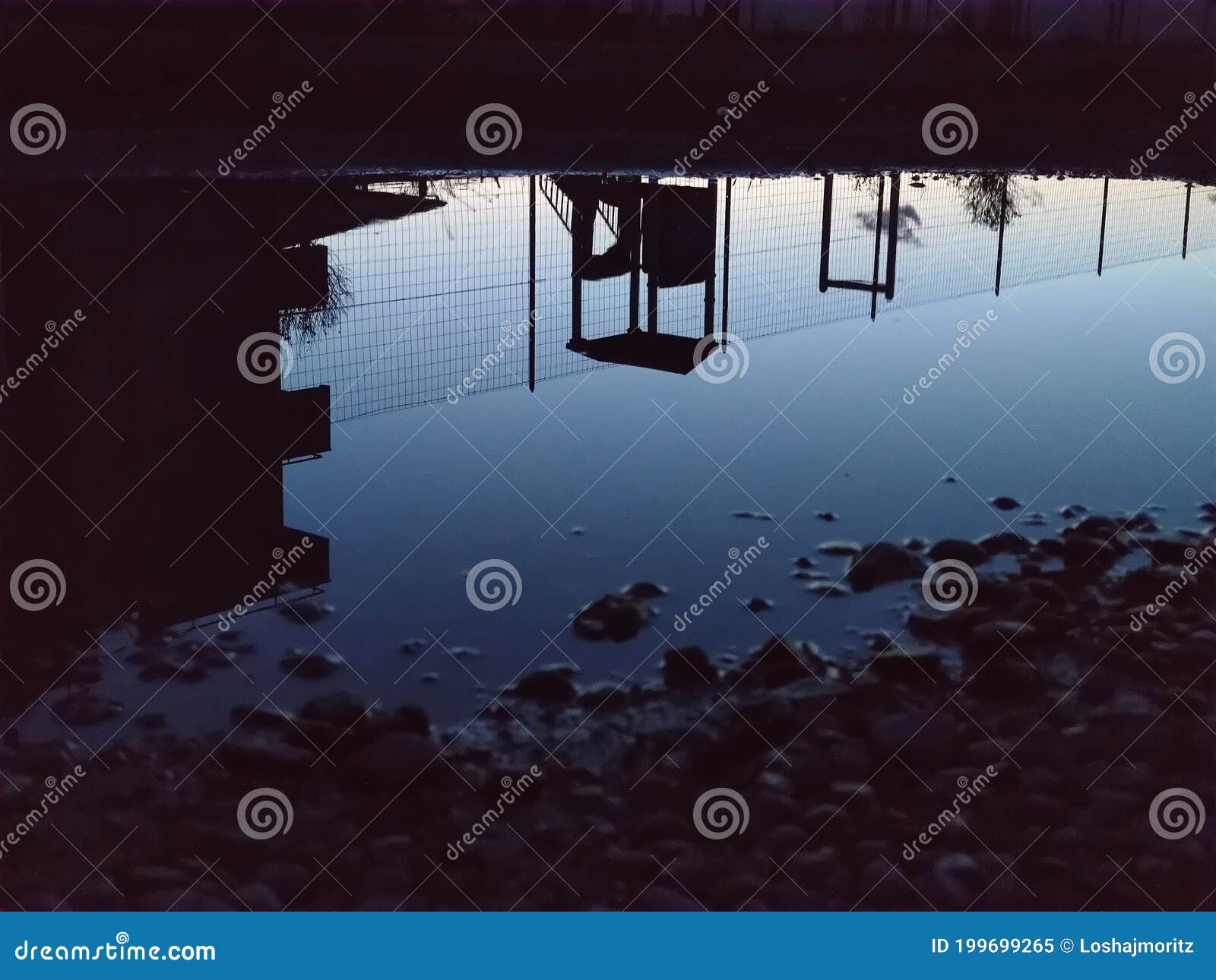 Reflection in a Puddle with Pebbles Stock Image - Image of reflection ...