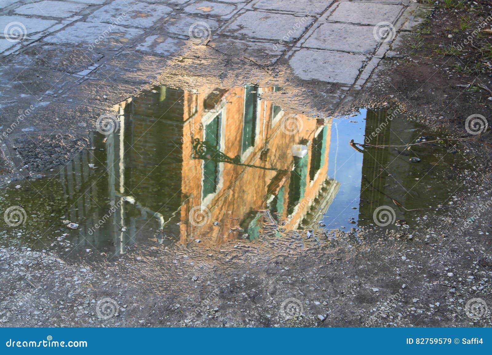 A reflection in a puddle stock image. Image of italy - 82759579