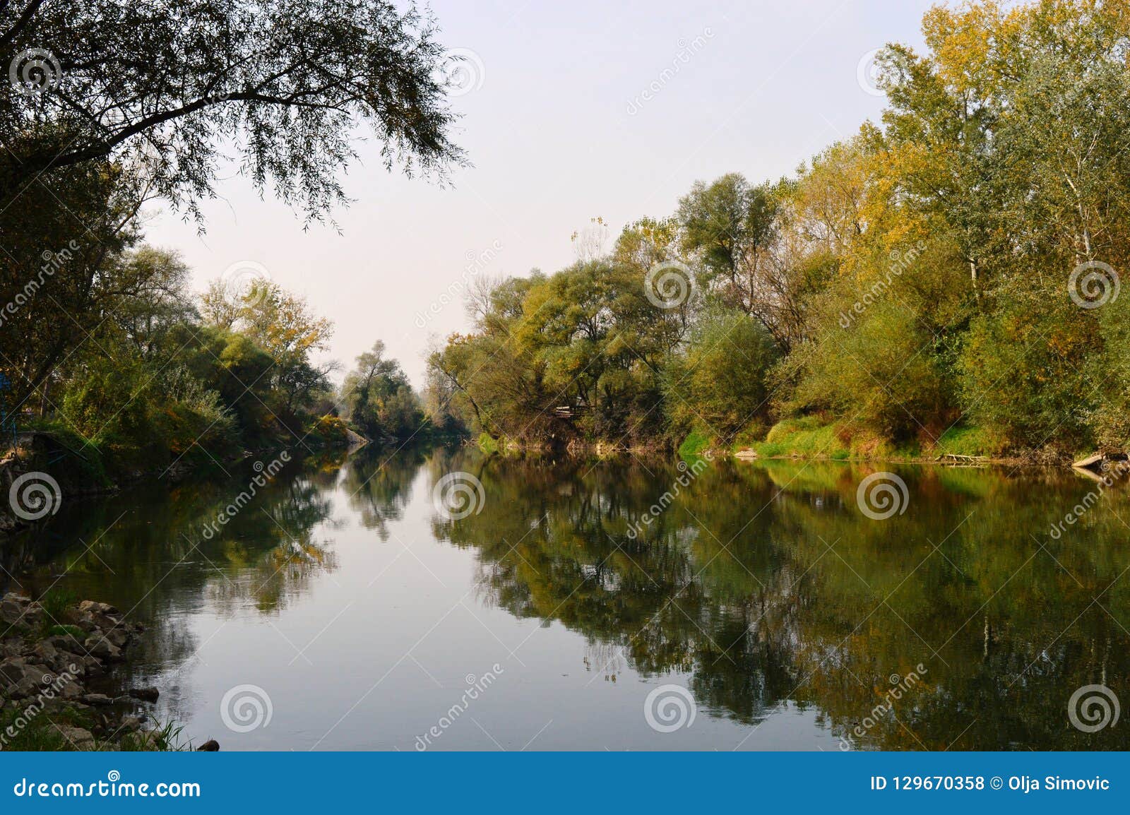 Reflection in the river stock photo. Image of river - 129670358