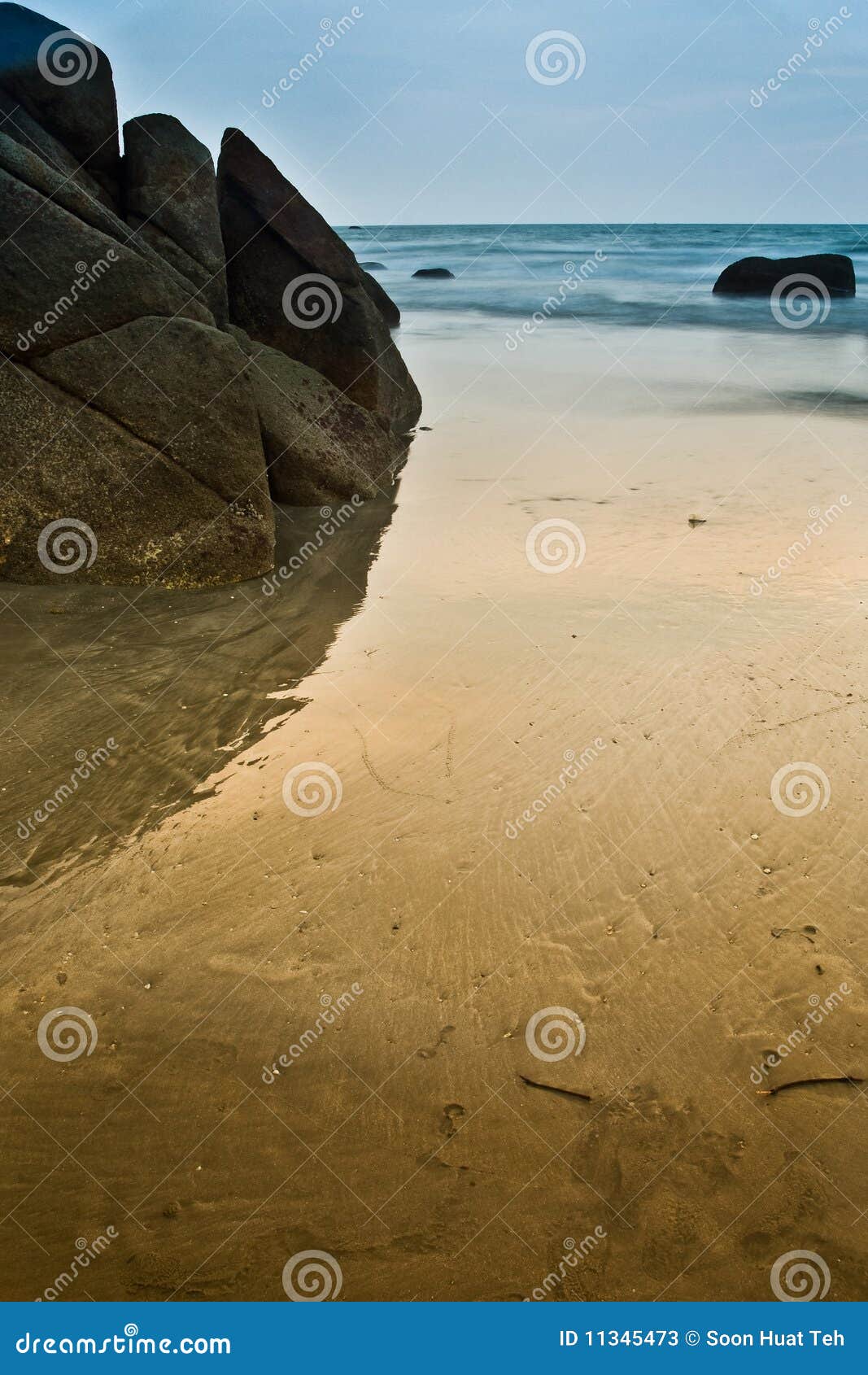 Reflection of Rock on Beach Stock Image - Image of seaside, ocean: 11345473