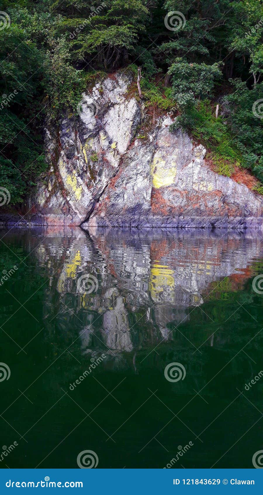 Reflection of Rocks in a Lake Stock Image - Image of shale, reflected ...