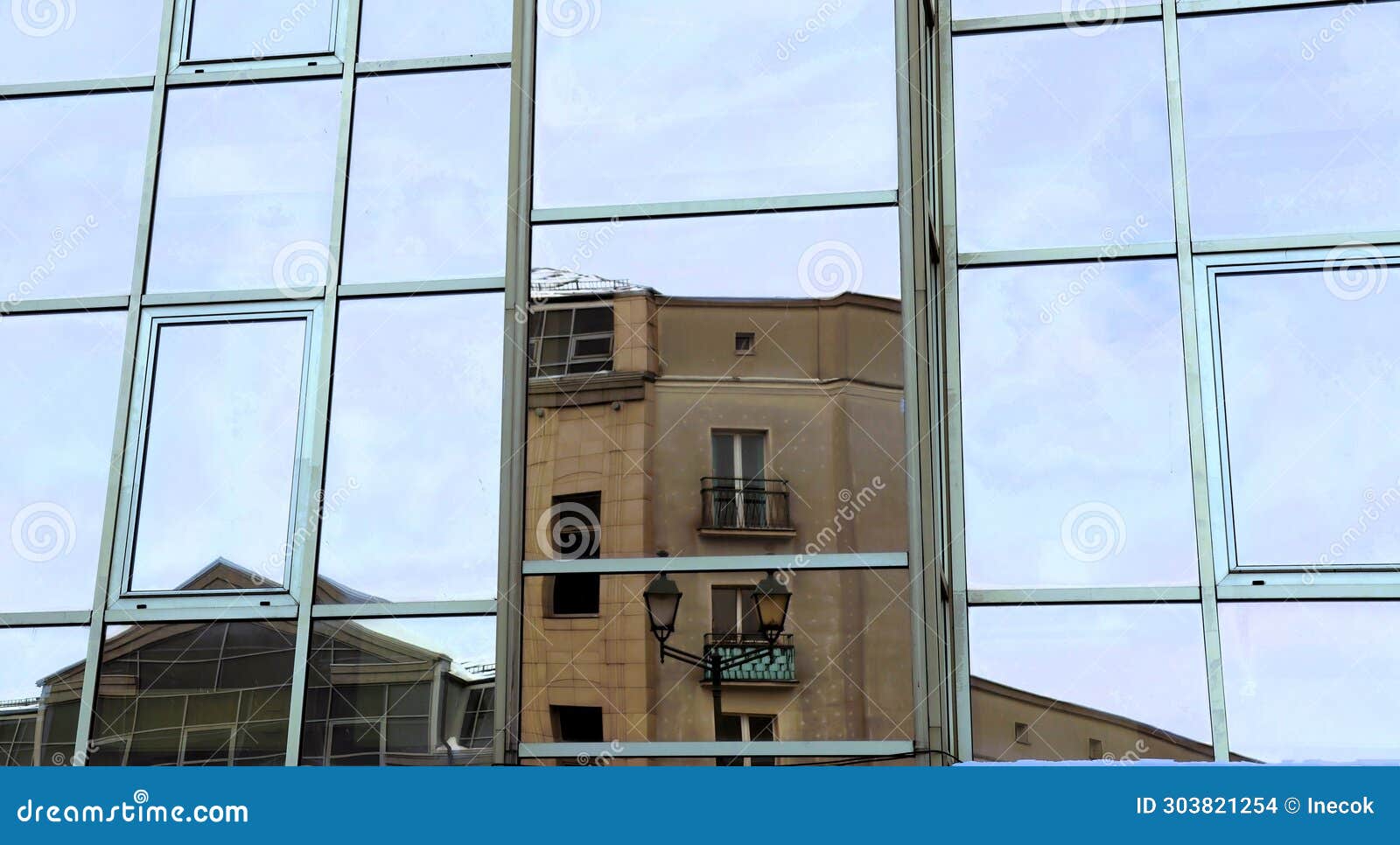 Reflection of the Roofs of Houses in the Mirror Windows of the Building ...