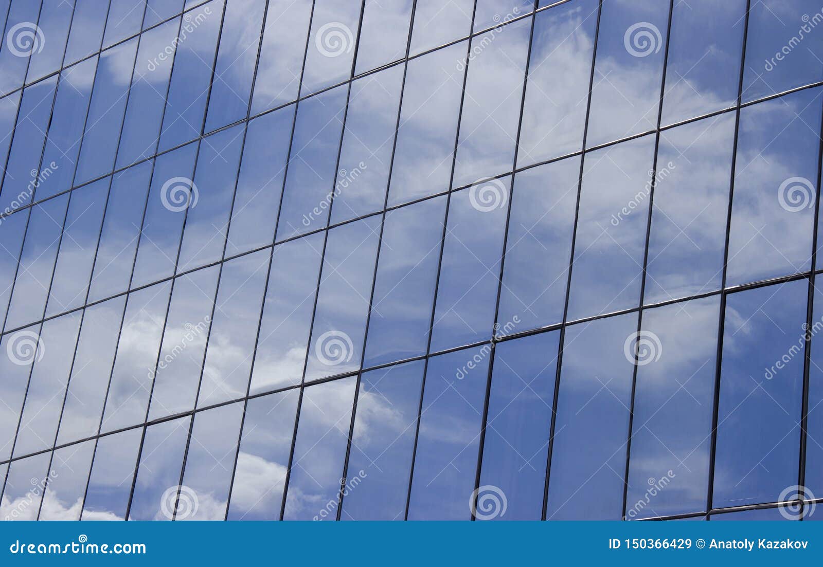 Reflection of the Sky with Clouds in the Glass Windows of the Building ...