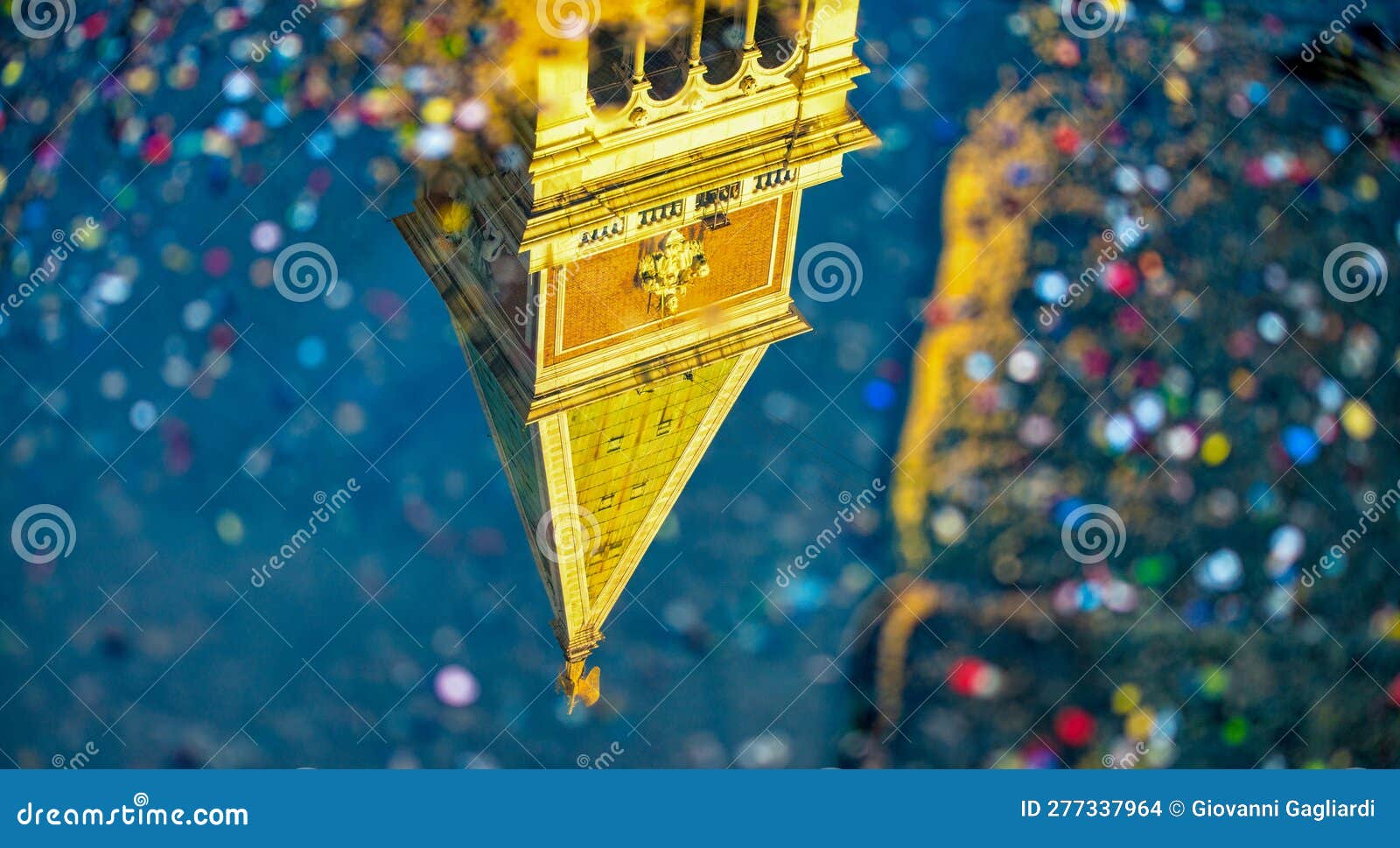 Reflection of St Mark Square Tower on a Pond, Venice during Carnival ...