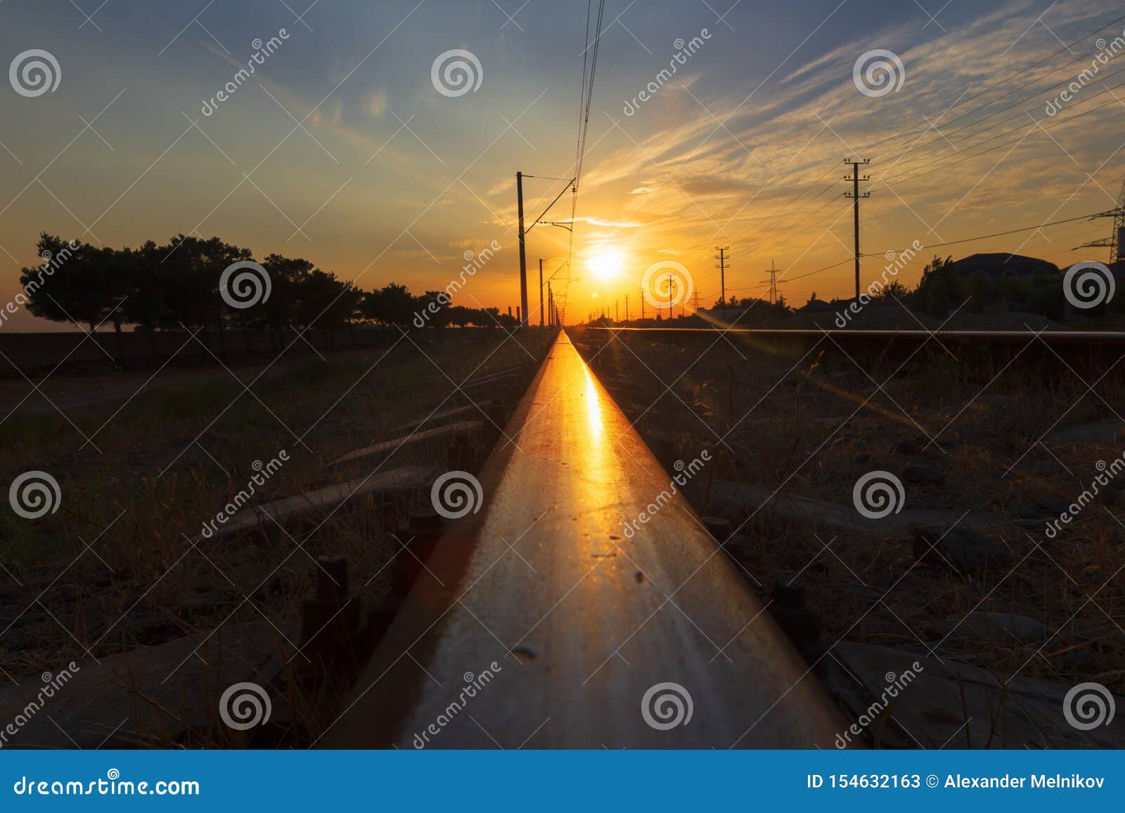 Reflection of the Sun on the Rails at Sunset Stock Image - Image of ...