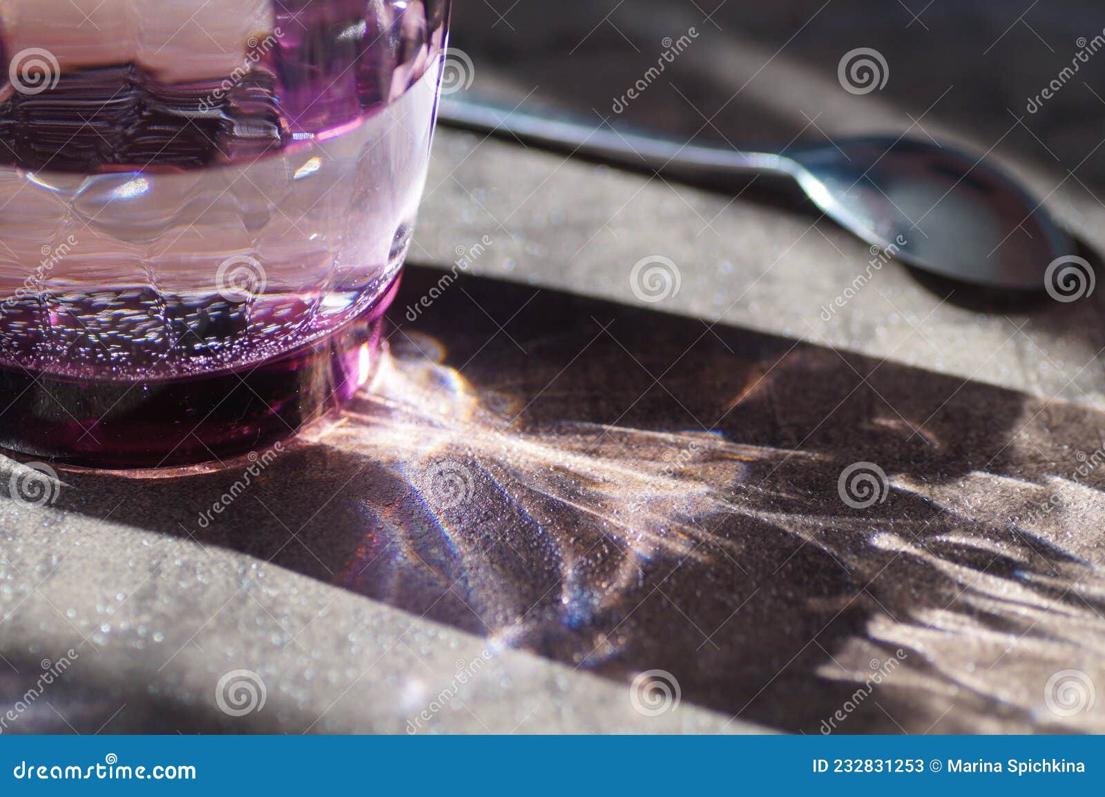Reflection of Sun Rays on the Table from a Glass of Water Stock Image ...