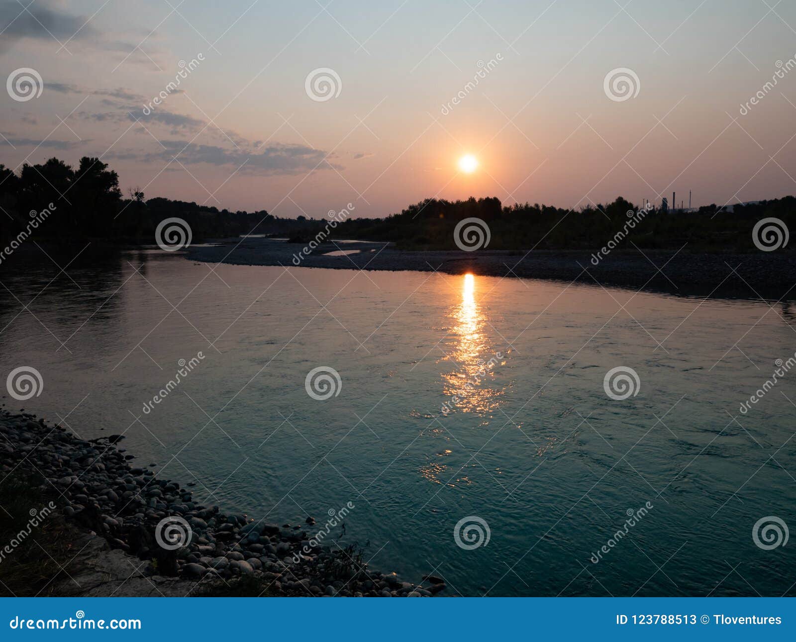 Sunrise Over a River with a Rocky Bank Stock Image - Image of dusk ...