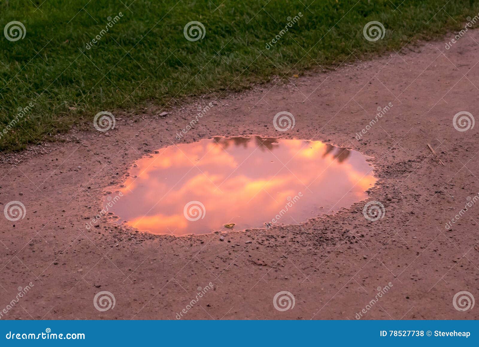 Reflection of Sunset in Puddle on Track Stock Photo - Image of pool ...