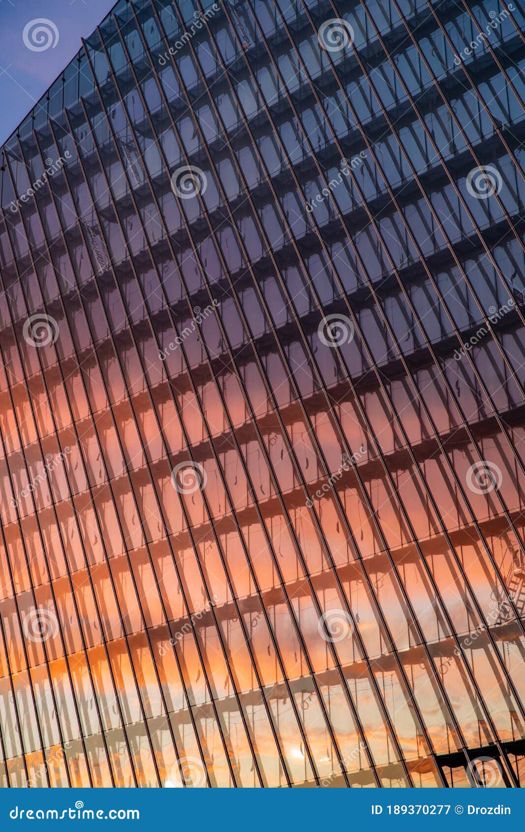 Reflection of the Sunset Sky in a Glass Facade of the Building ...