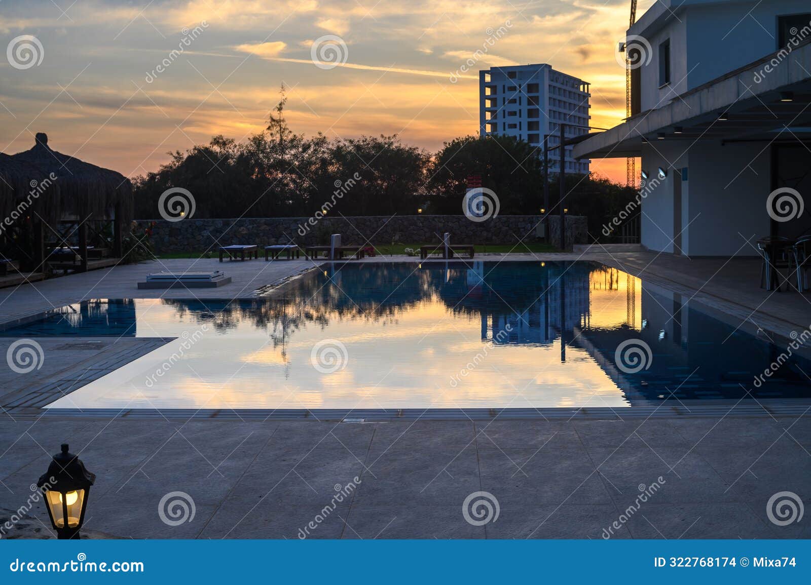 Reflection of the Sunset Sky in a Swimming Pool in a Residential ...