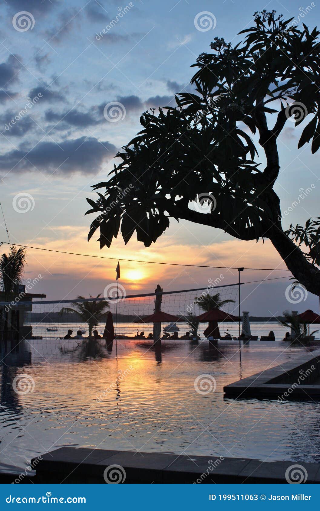 Reflection of Sunset in Swimming Pool by the Sea Stock Image - Image of ...