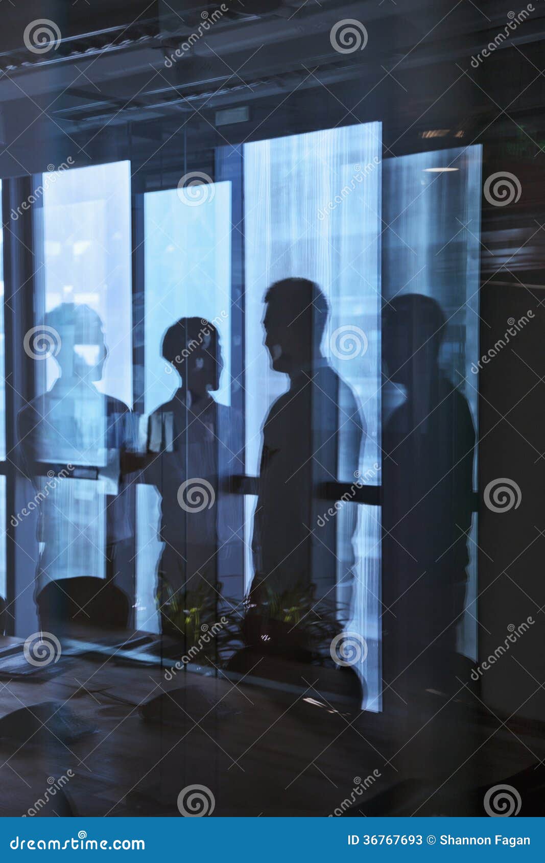 Reflection of Two Businessmen Talking in the Office Stock Image - Image ...
