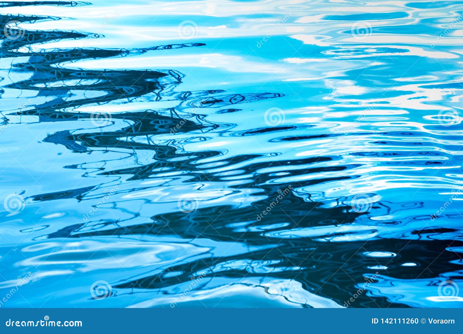 Reflection on water stock photo. Image of blue, sunlight - 142111260