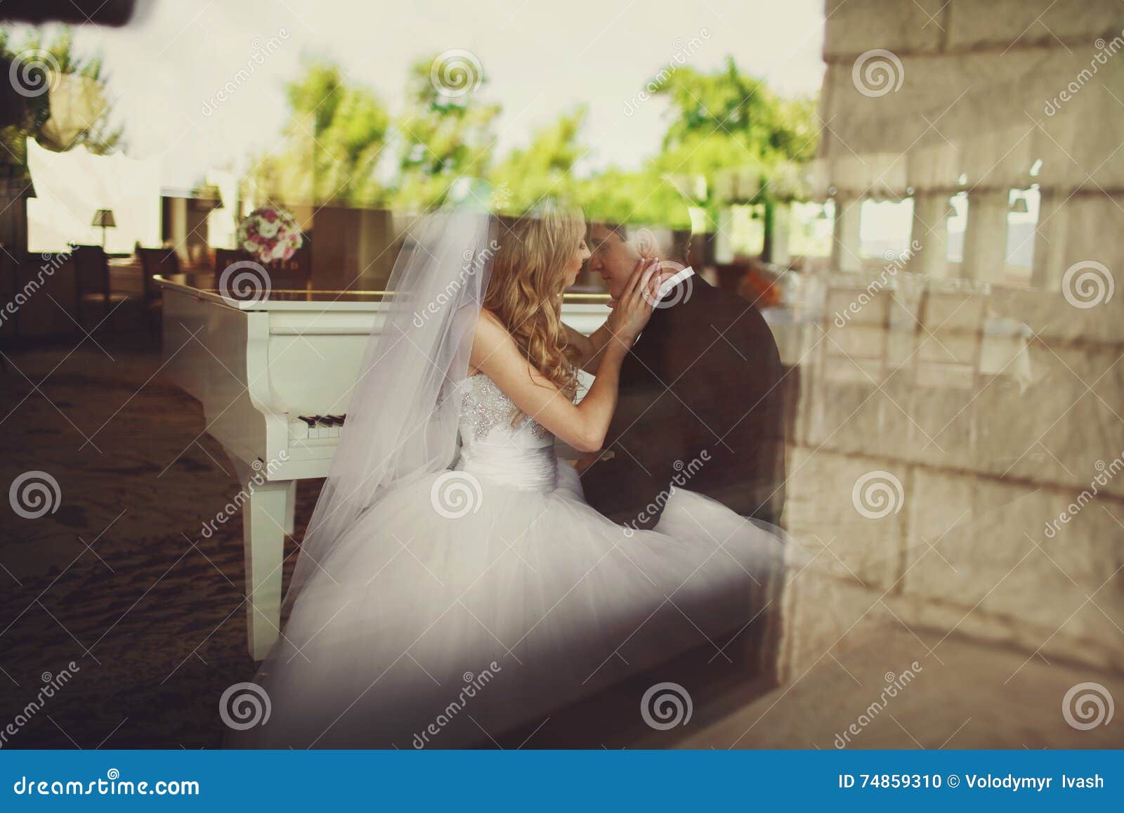 A Reflection in Window of Tender Wedding Couple Sitting at the W Stock ...