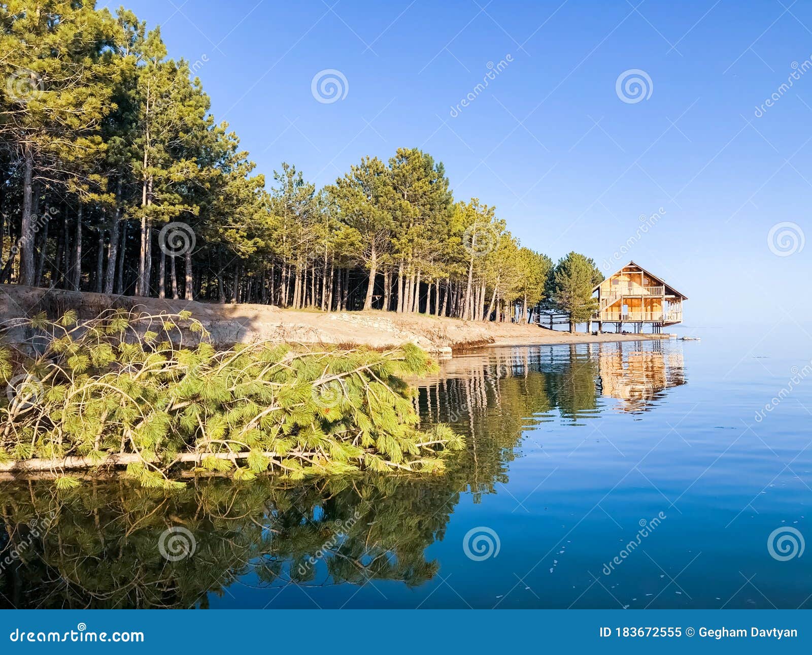Reflection of a Wooden House on the Lake, House on the River Stock ...