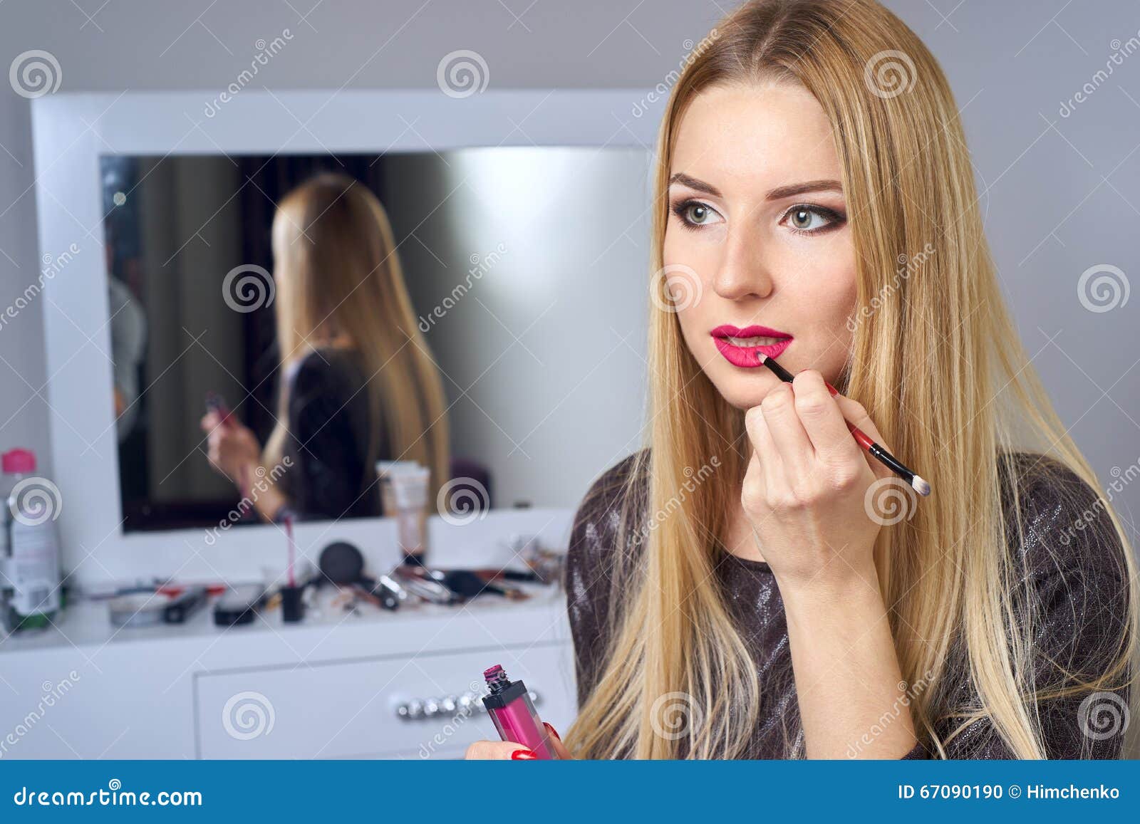 Reflection of Young Beautiful Woman Applying Her Make-up Stock Photo ...