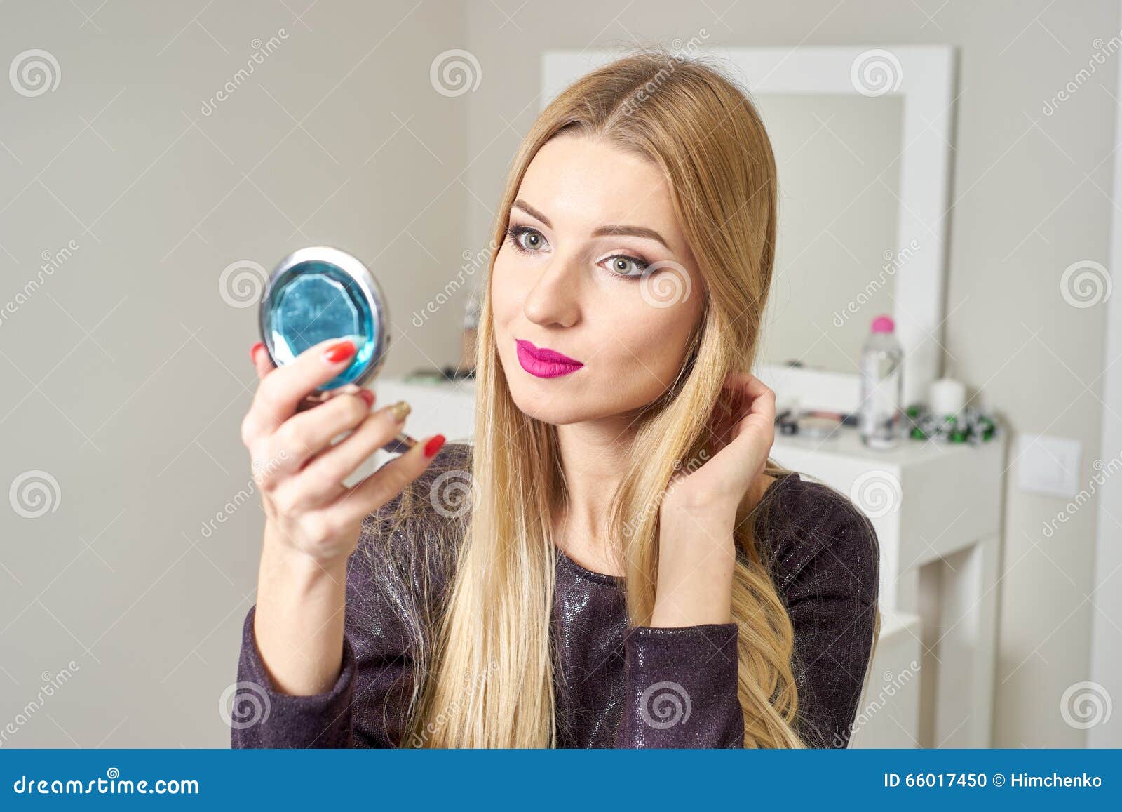 Reflection of Young Beautiful Woman Applying Her Make-up, Looking in a ...