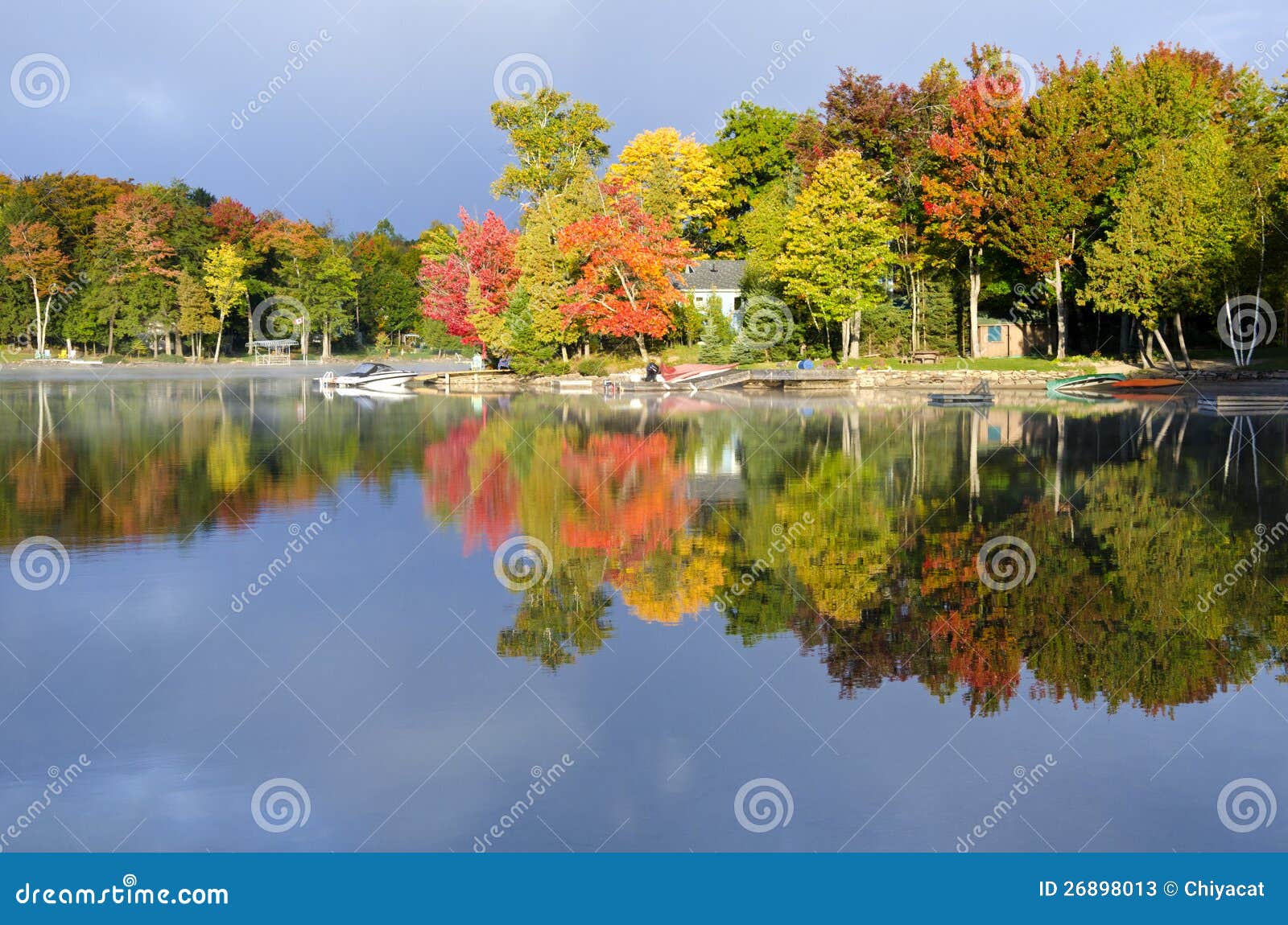 Reflections of Fall Colors on a Tranquil Lake Stock Image - Image of ...
