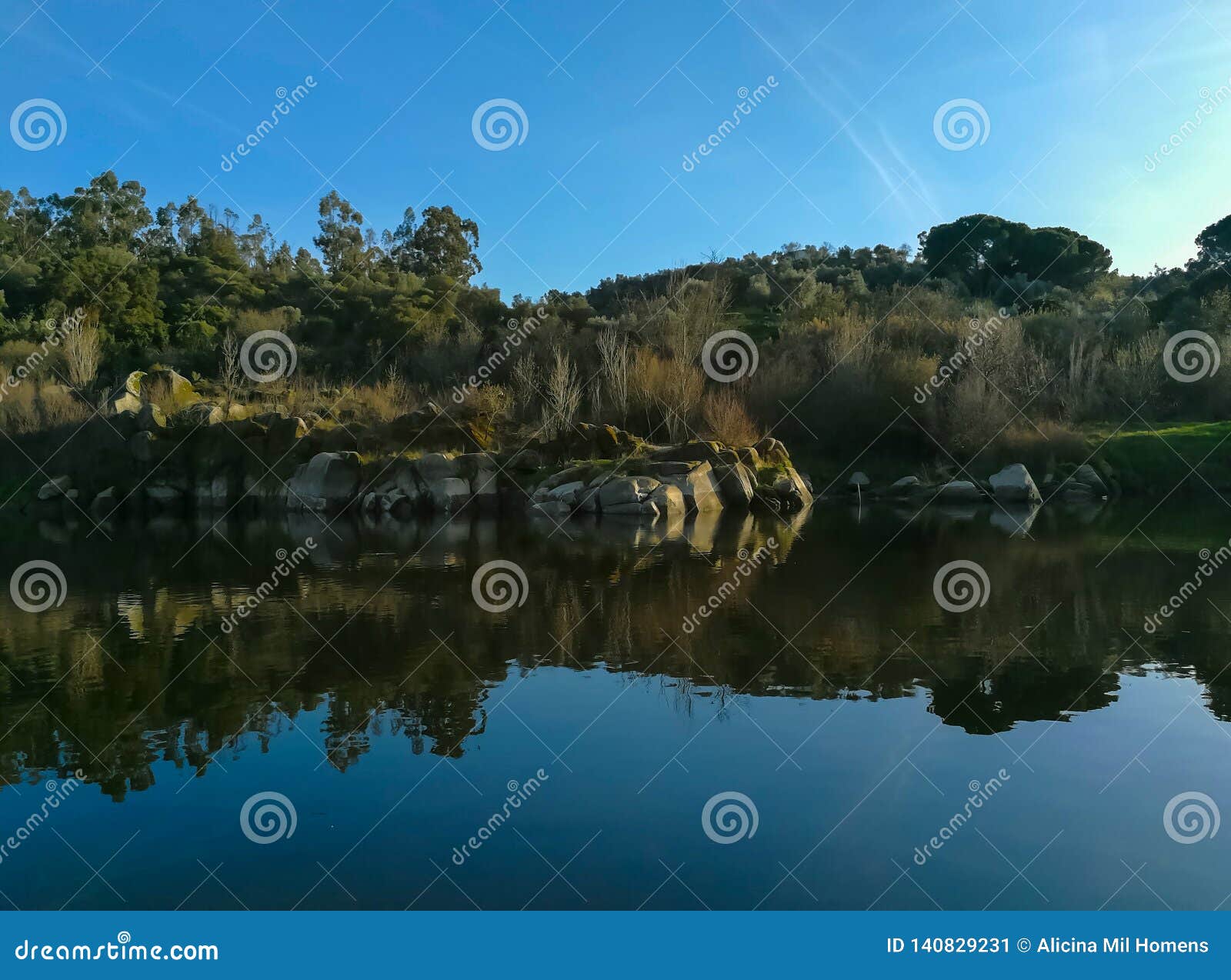 Reflections at Sunset Over the Water Stock Image - Image of green ...