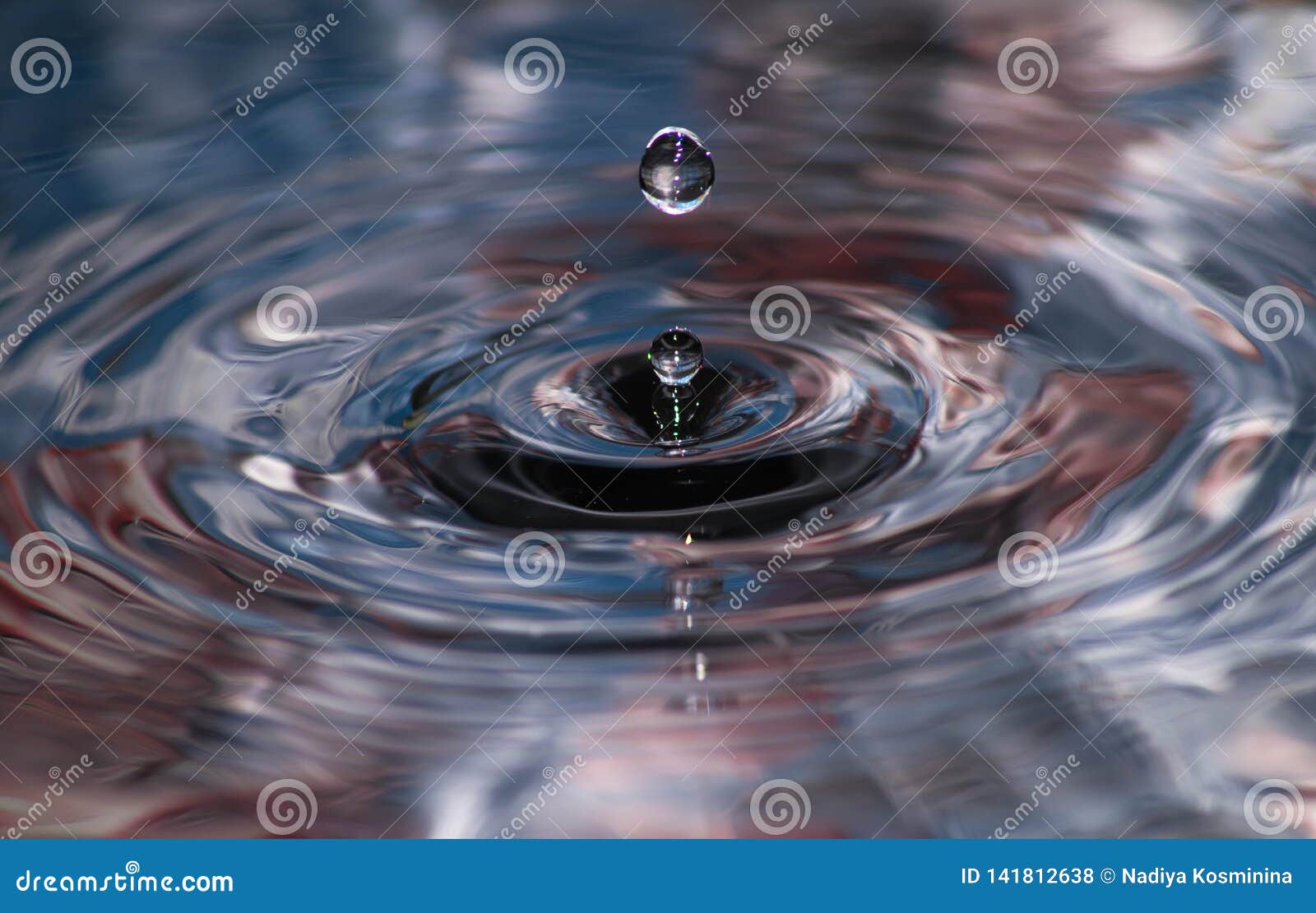 Reflections in water drops stock photo. Image of mirror - 141812638