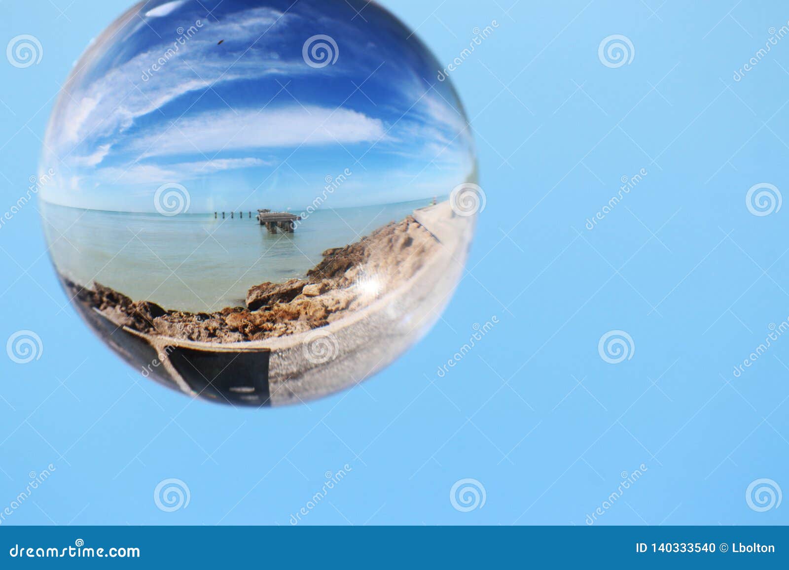 Reflective Crystal Ball with Beach Stock Photo - Image of calm, seas ...