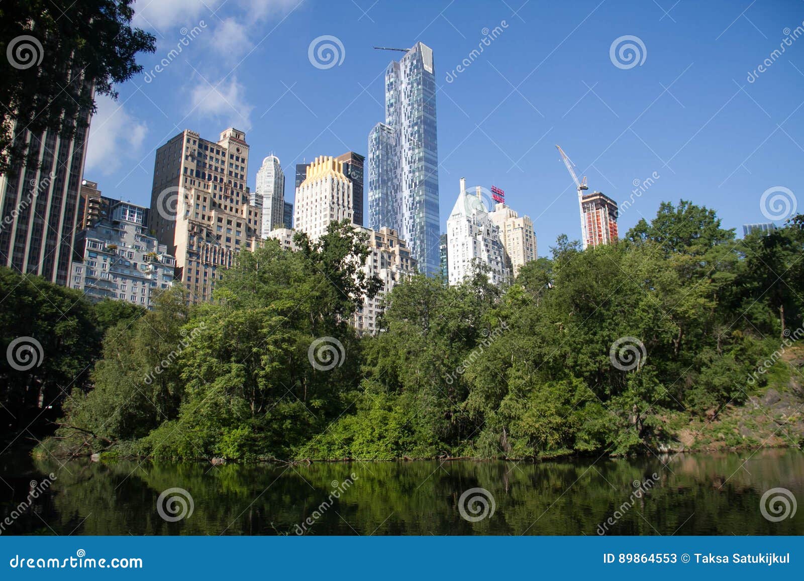 Reflective Lake Under the Shade and Buildings in Summertime Editorial ...