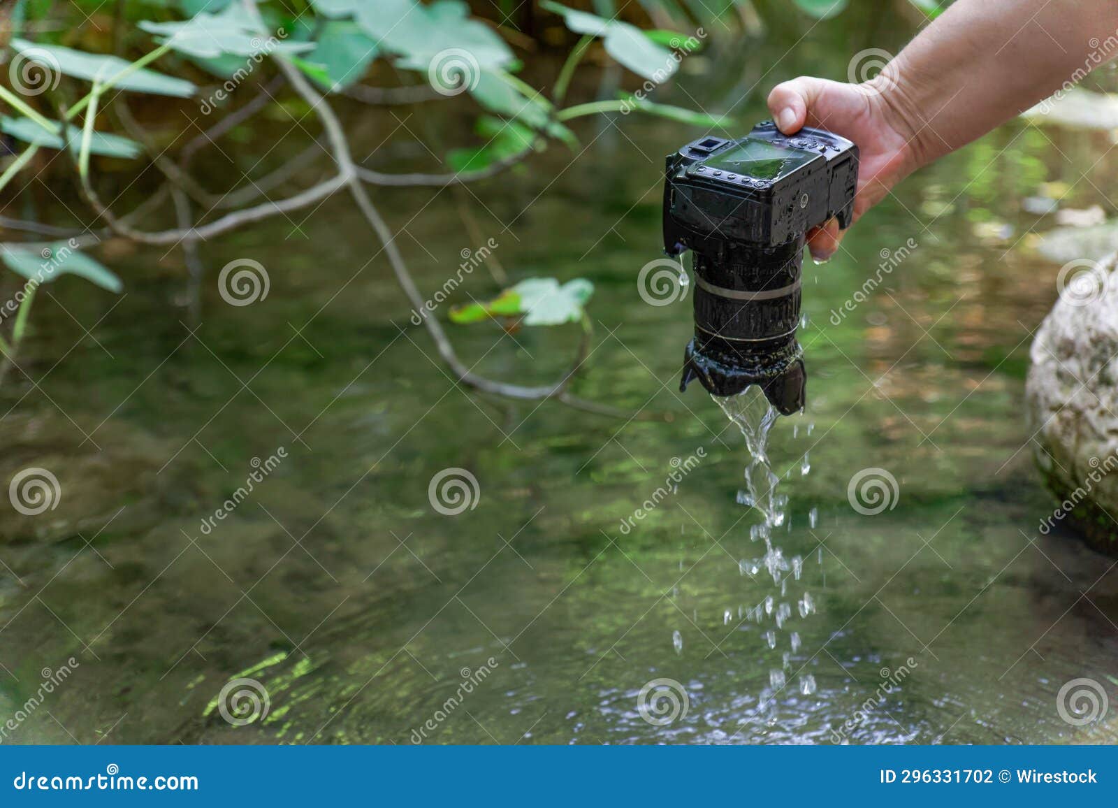Man Pulls His Reflex Camera Out of the River Flooded with Water Stock ...