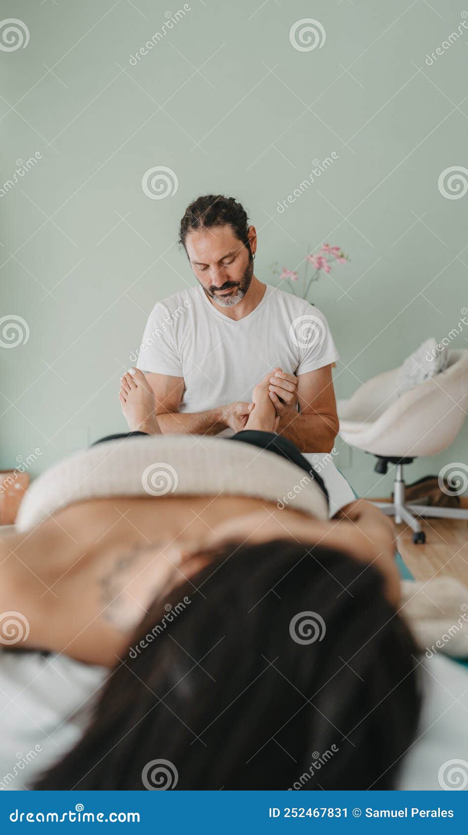 Reflexology Office Technician Working with a Patient& X27;s Feet Stock ...
