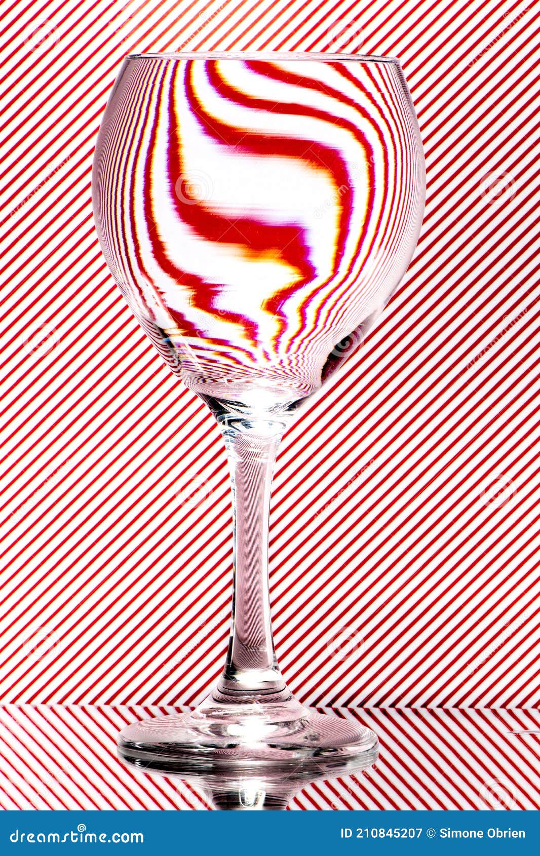 Refraction of Light by a Wine Glass on a Red and White Striped ...