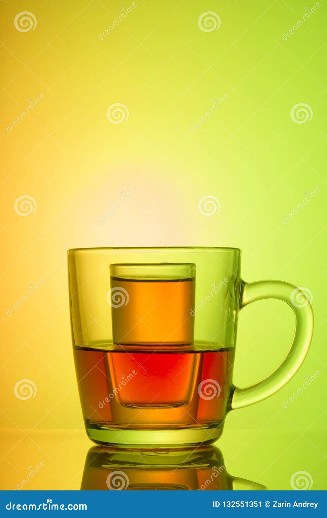 Refraction of Liquid in Glass, a Glass in a Mug of Tea, on a Col Stock ...