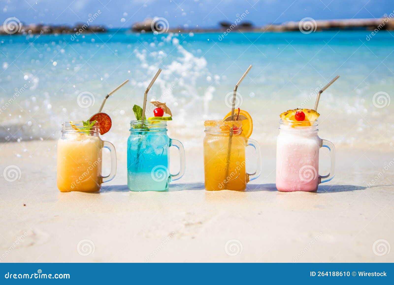 Refresh Cocktail Drinks on Sandy Beach with Splashing Water Stock Photo ...