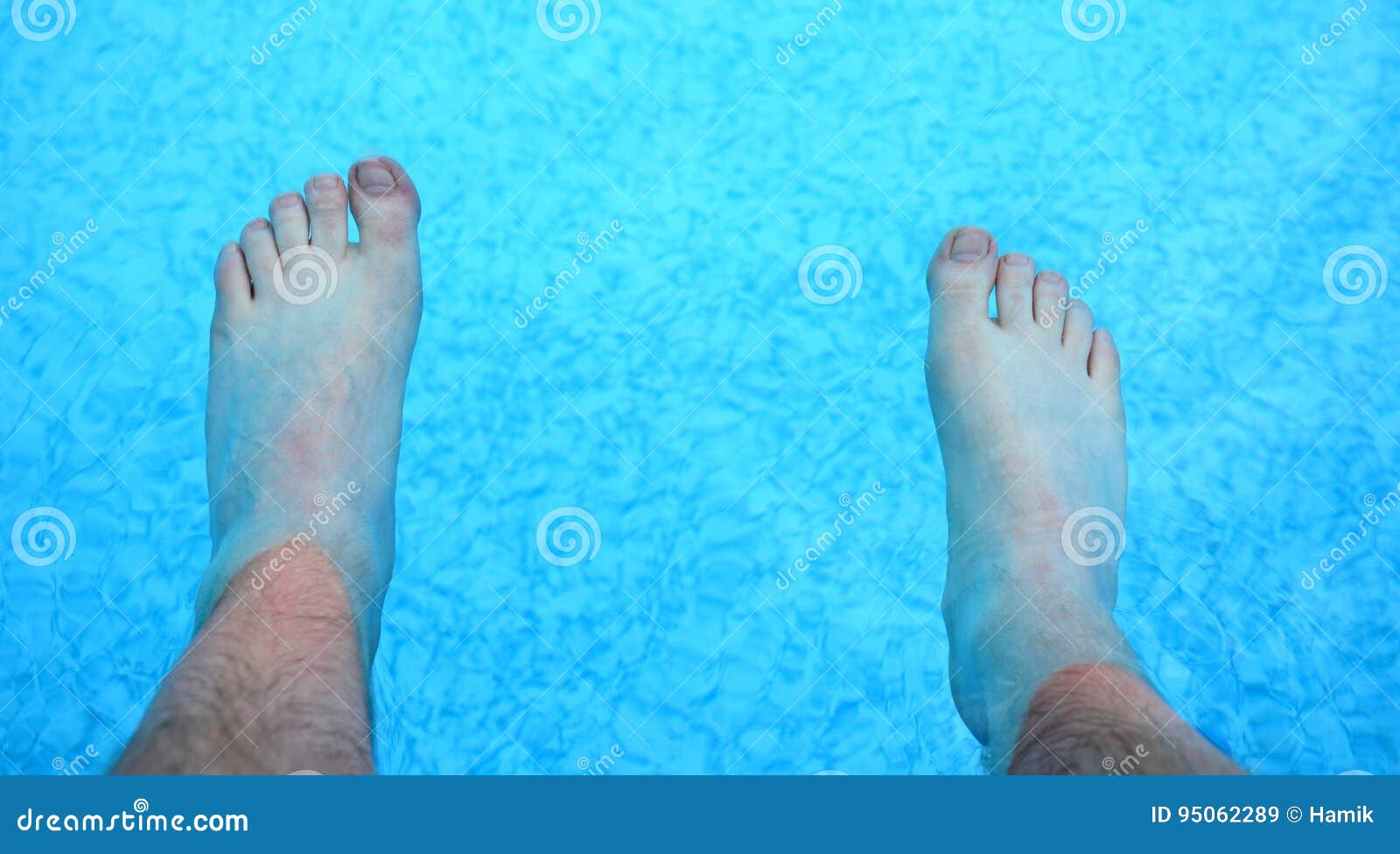 Refreshing feet in a pool stock image. Image of wave - 95062289