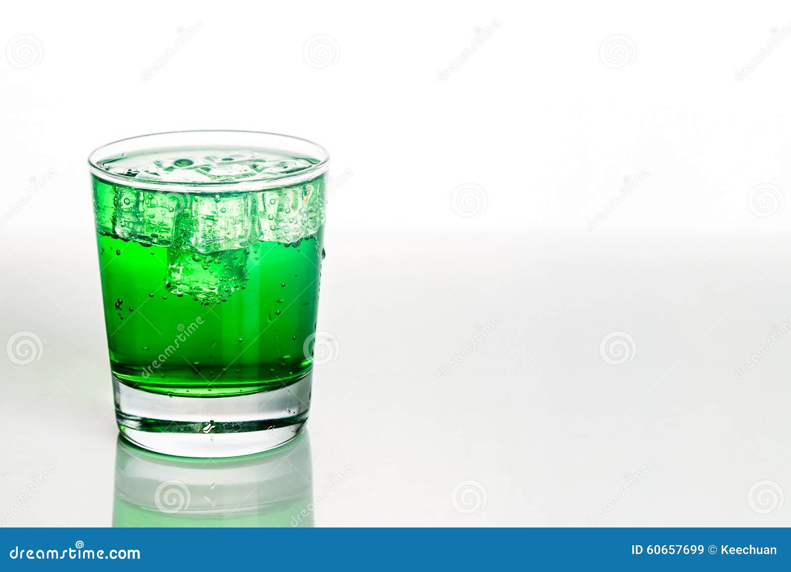 Refreshing Green Fizzy Soft Drink with Ice in Transparent Glass Stock ...
