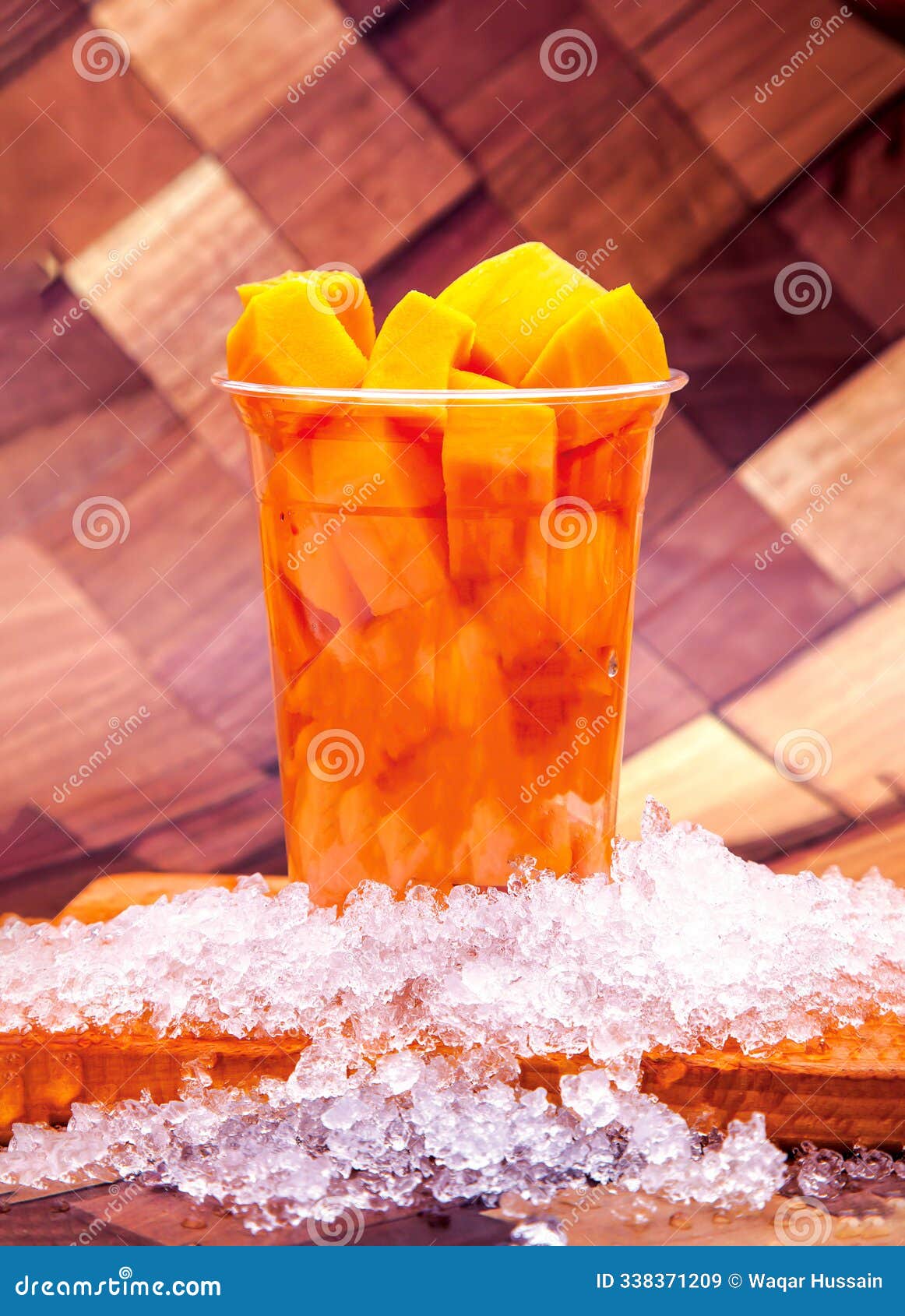 Refreshing Mango Chunks Bricks with Crushed Ice Served in Plastic Cup ...