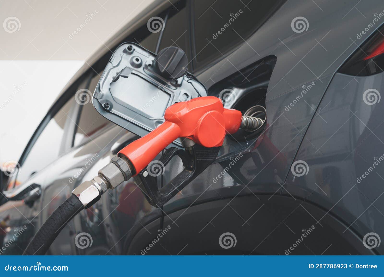Refuel car with petrol stock image. Image of hand, holding - 287786923