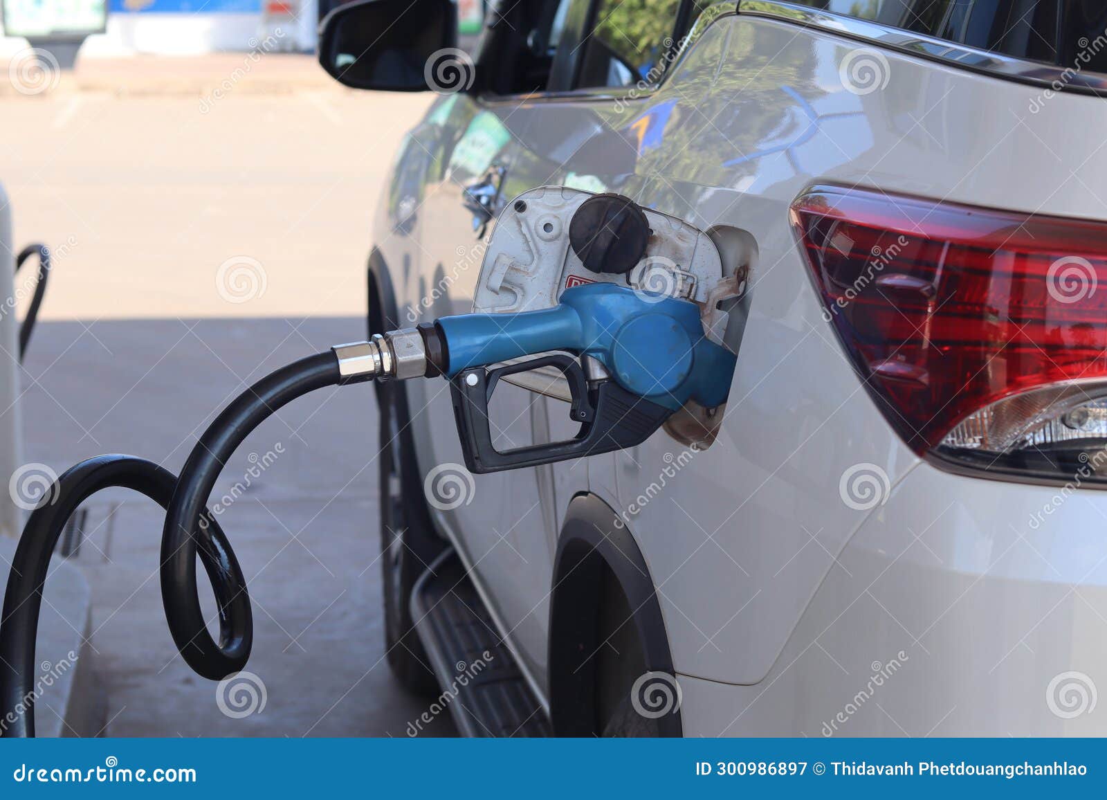 Refueling a car stock image. Image of environment, building - 300986897