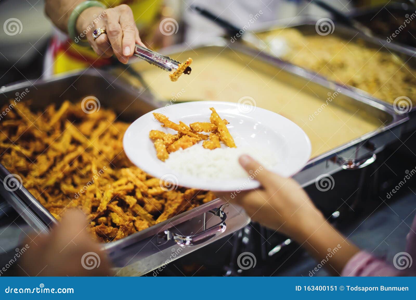 Refugees` Hands are Receiving Food from Philanthropists: the Concept of ...