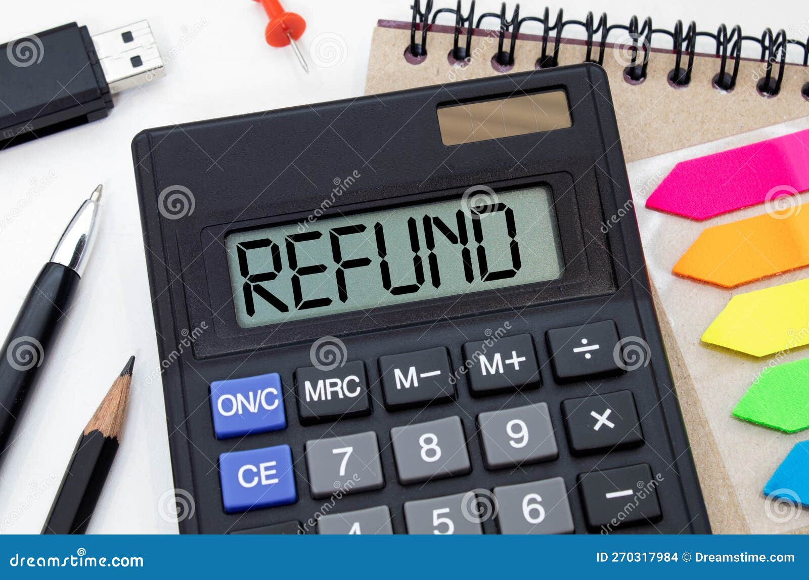 REFUND Text Written on Notepad on the Blue Background Stock Photo ...