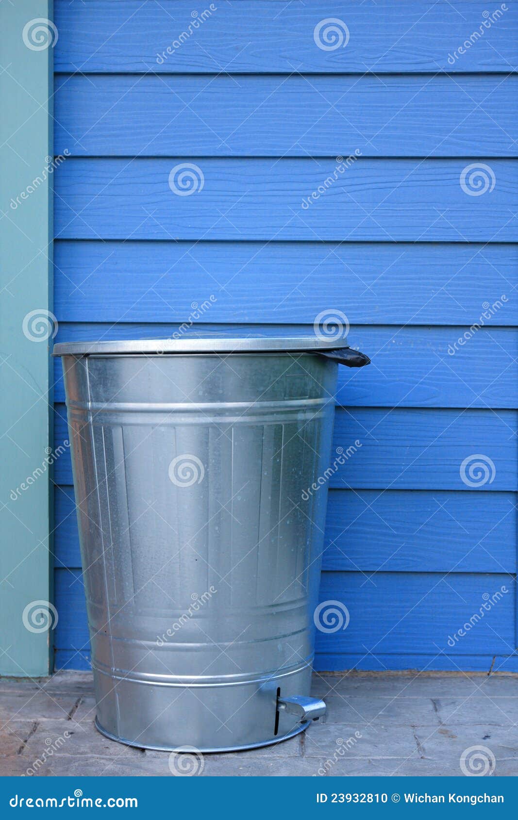Refuse bin and blue wall stock photo. Image of garbage - 23932810