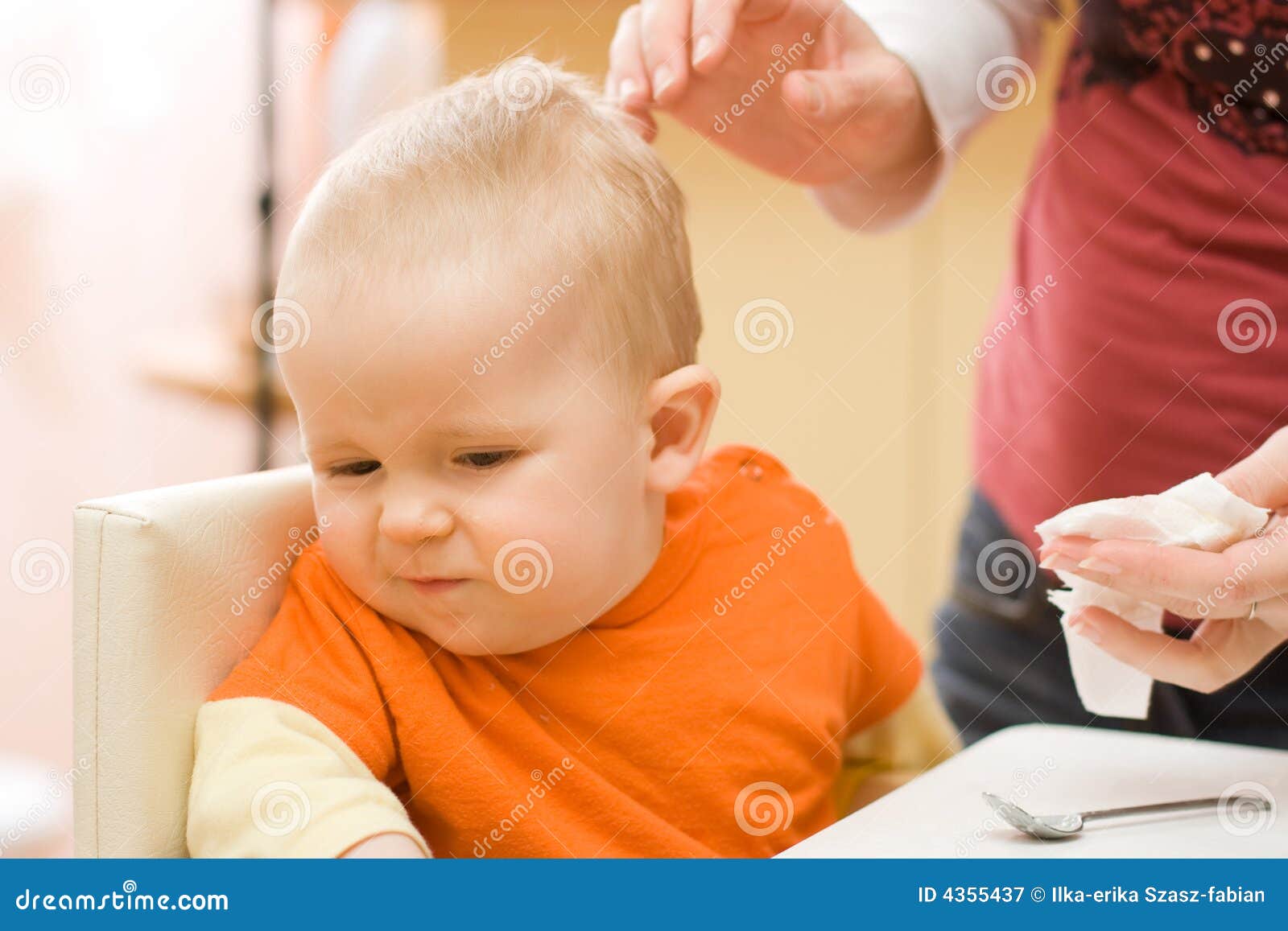 Refusing to be wiped stock image. Image of baby, expression - 4355437
