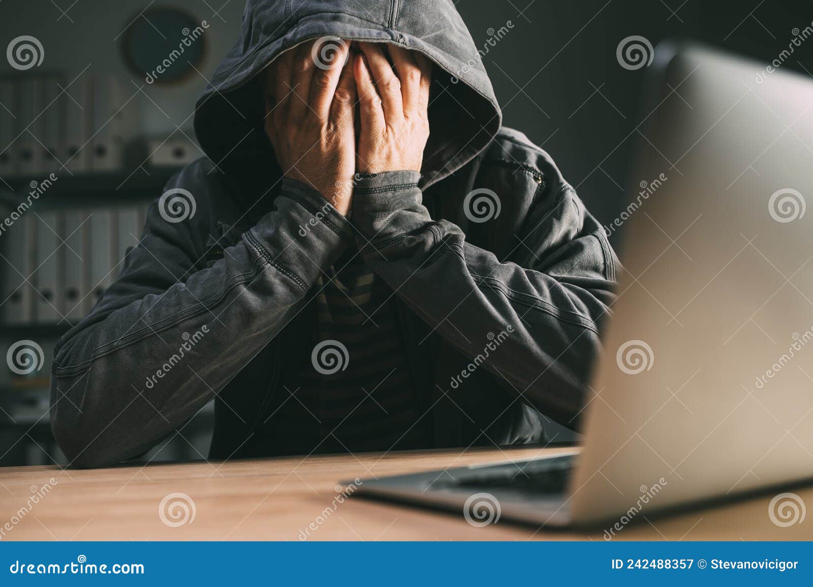 Regretful Computer Hacker Covering Face with Hands in Front of Laptop ...