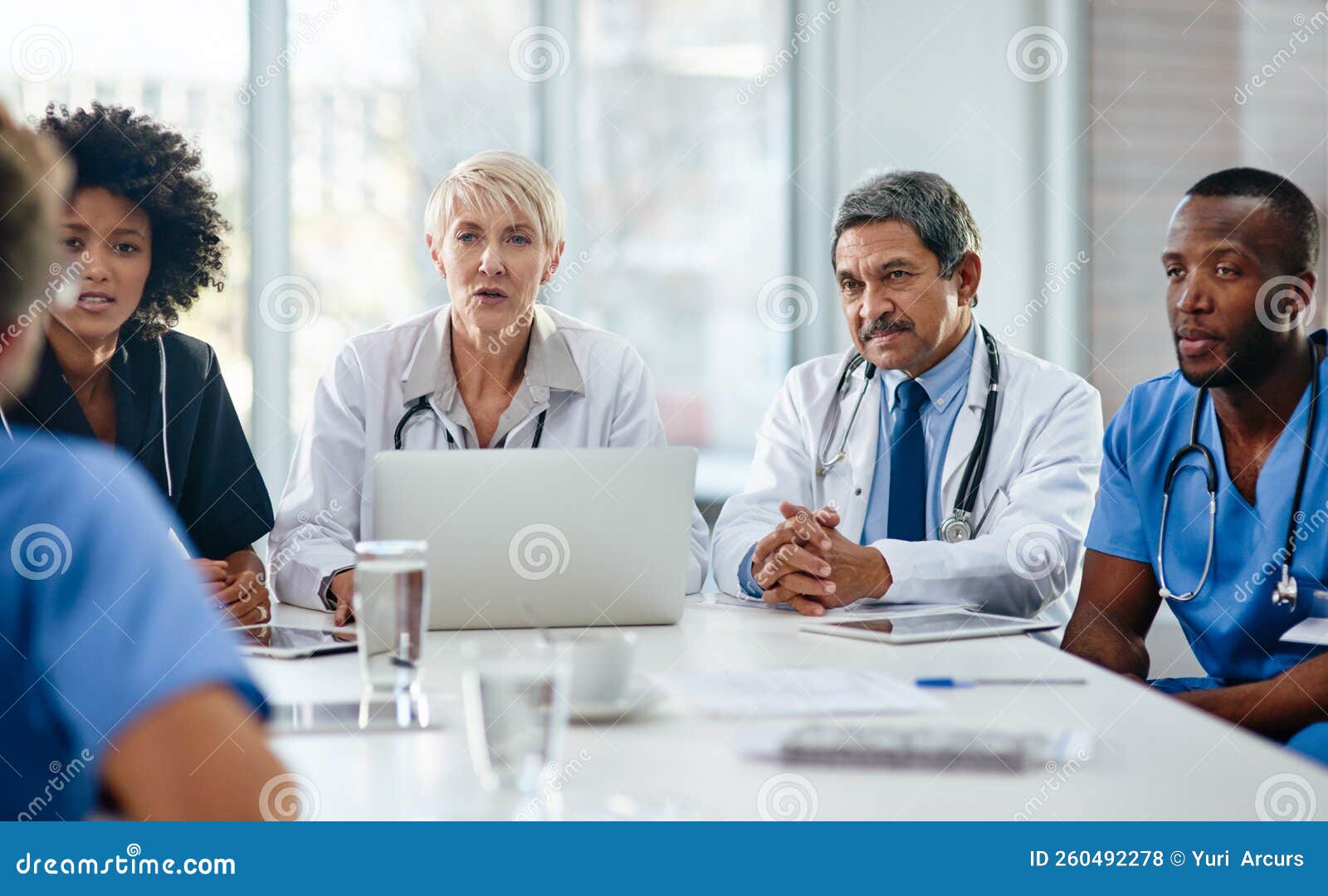 Regular Meetings Keep Them in the Loop. a Team of Doctors Having a ...