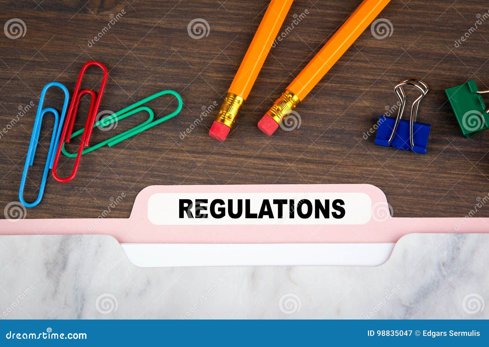 Regulations Concept. Folder Register on a Dark Wooden Desk Stock Image ...