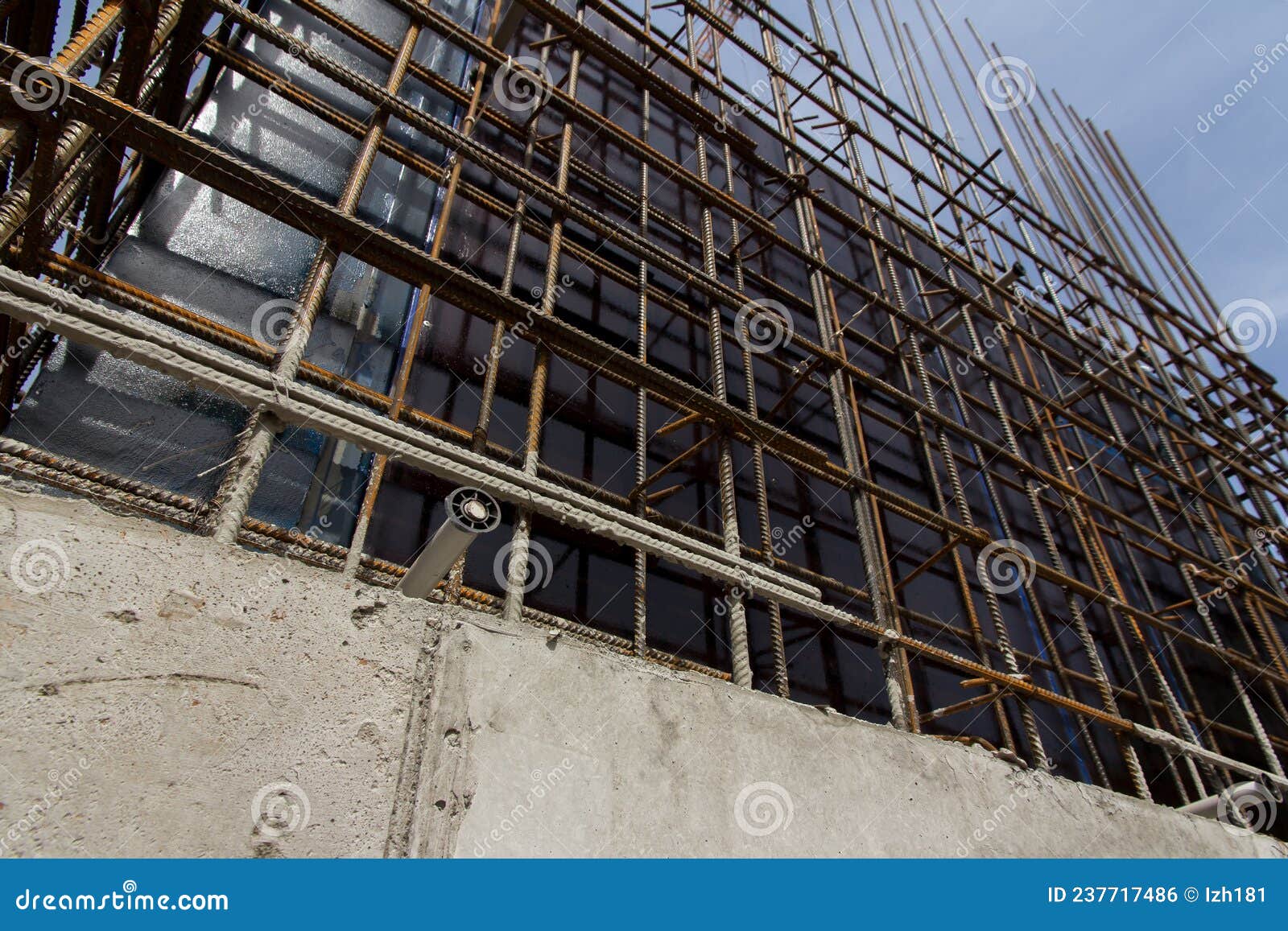 Reinforced Concrete Structure and Tower Crane Against the Blue Sky ...