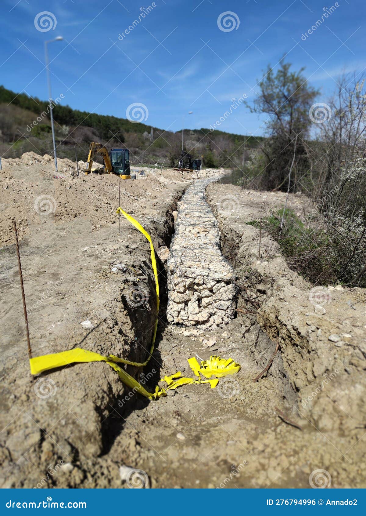 Reinforcing the Edge of the Road with Stones in a Metal Mesh Stock ...