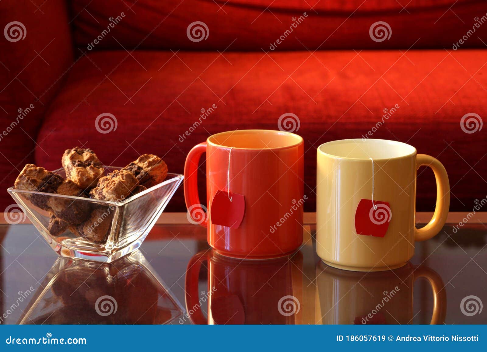 Relax Concept: Two Cups of Tea Rest on a Glass Small Table with Cookies ...