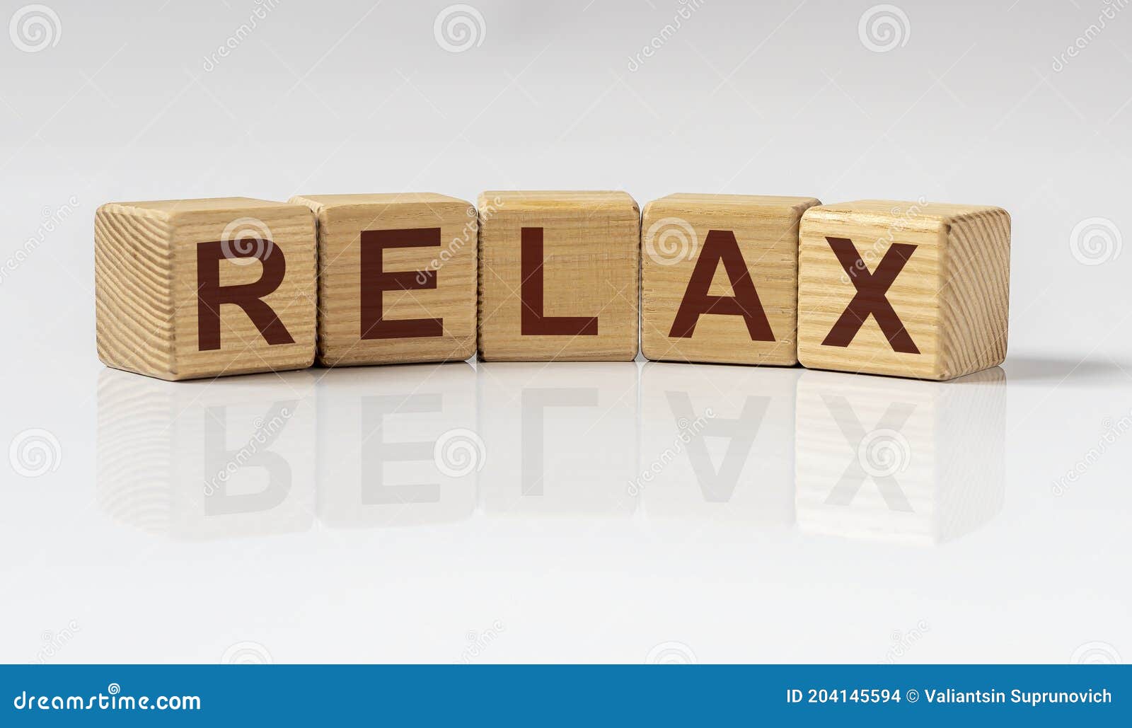 RELAX Word Written on Wooden Cube Blocks on White Glossy Table with ...
