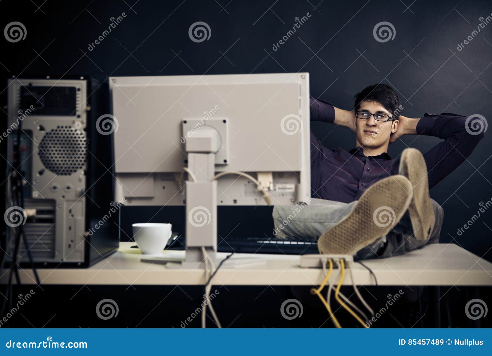 Relaxed Admin at His Desk stock image. Image of server - 85457489