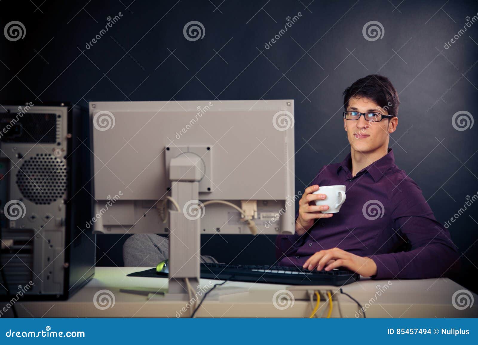 Relaxed Admin at His Desk stock photo. Image of working - 85457494