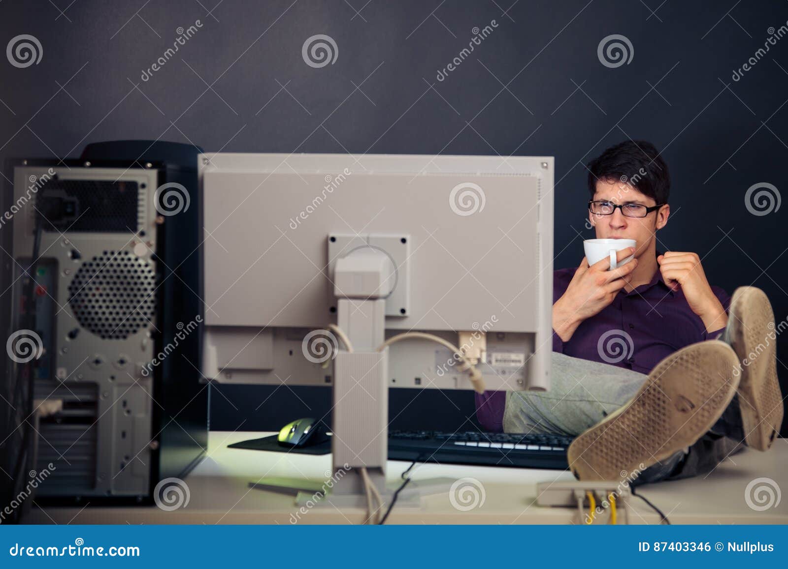 Relaxed Admin at His Desk stock photo. Image of monitor - 87403346